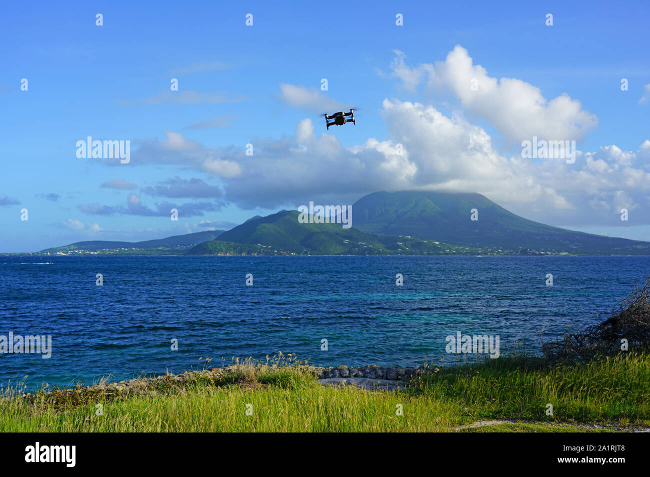 Day view of the Nevis Peak volcano across the water from St Kitts Stock ...