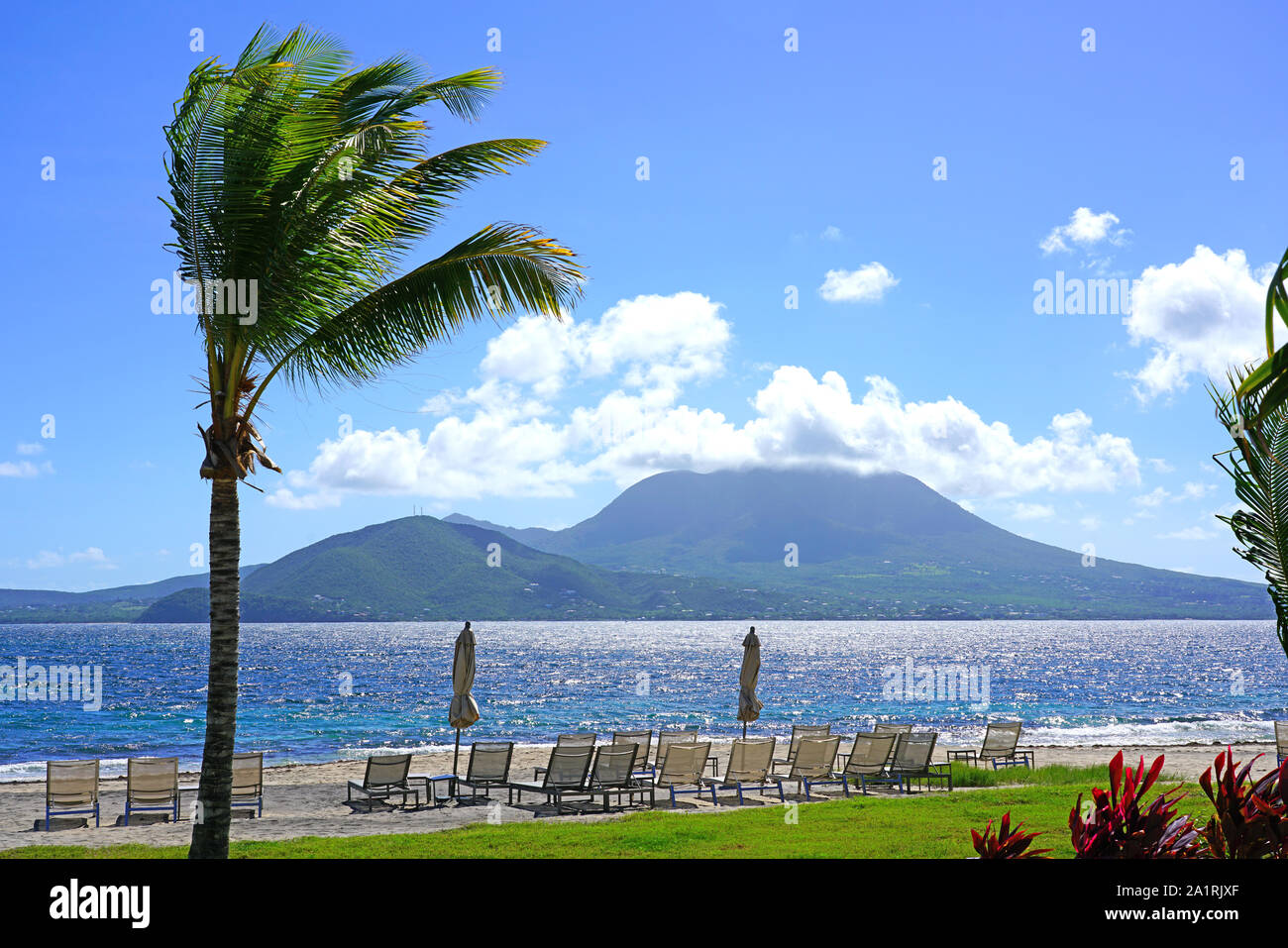 Day view of the Nevis Peak volcano across the water from St Kitts Stock ...