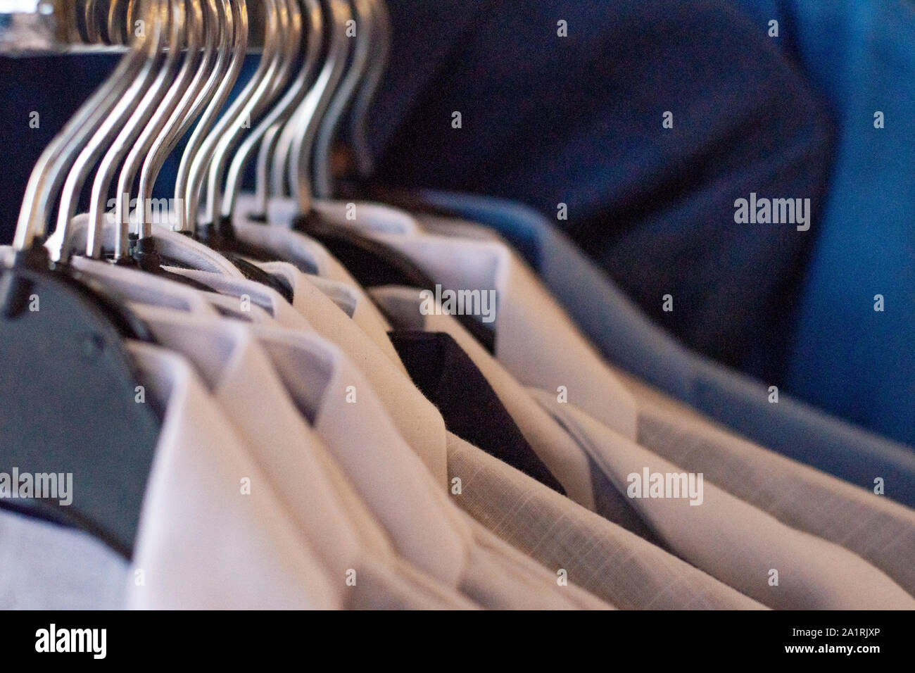 Shelf with folded shirts hi-res stock photography and images - Alamy