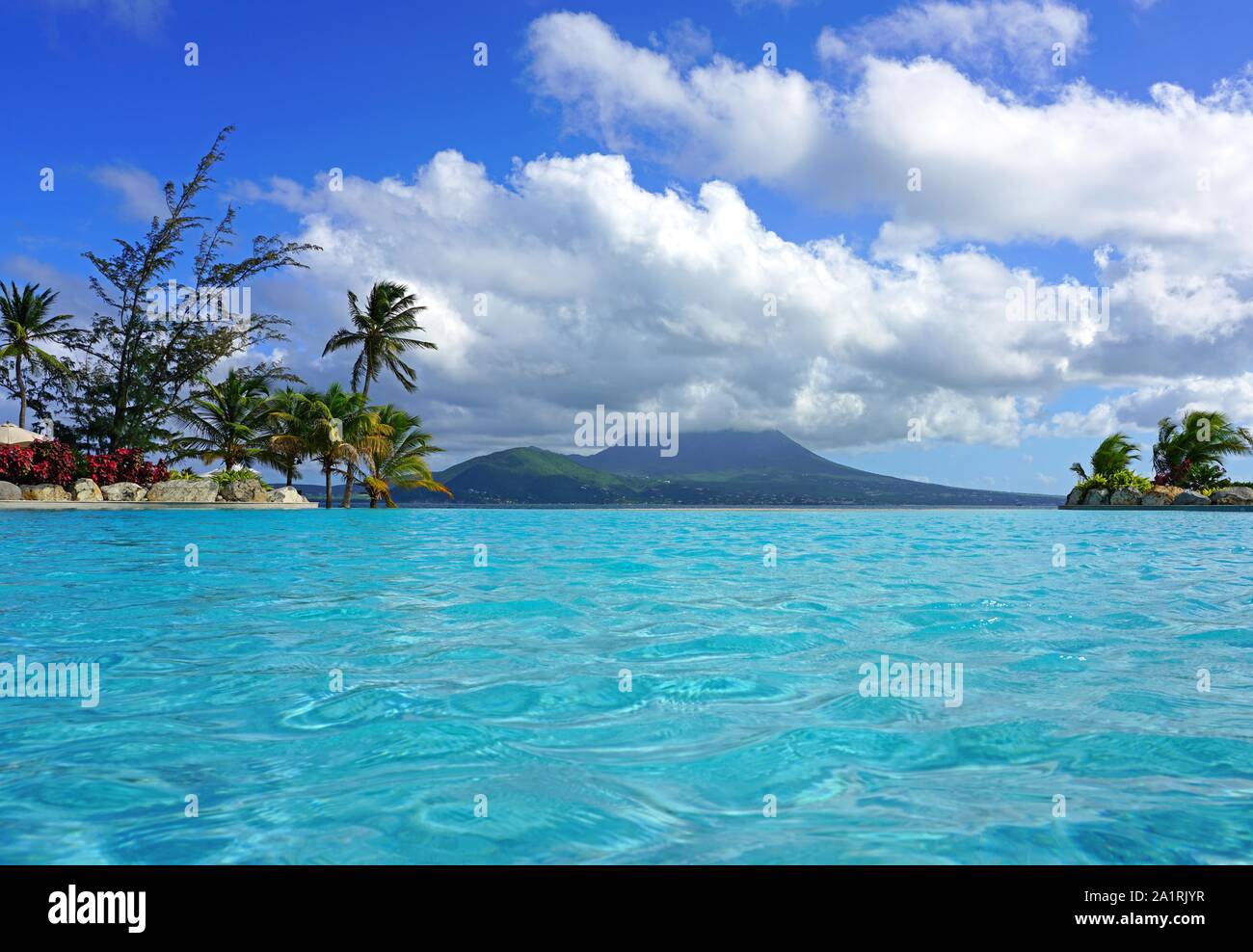 Day view of the Nevis Peak volcano across the water from St Kitts Stock ...