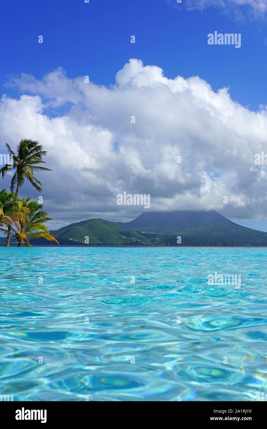 Day view of the Nevis Peak volcano across the water from St Kitts Stock ...