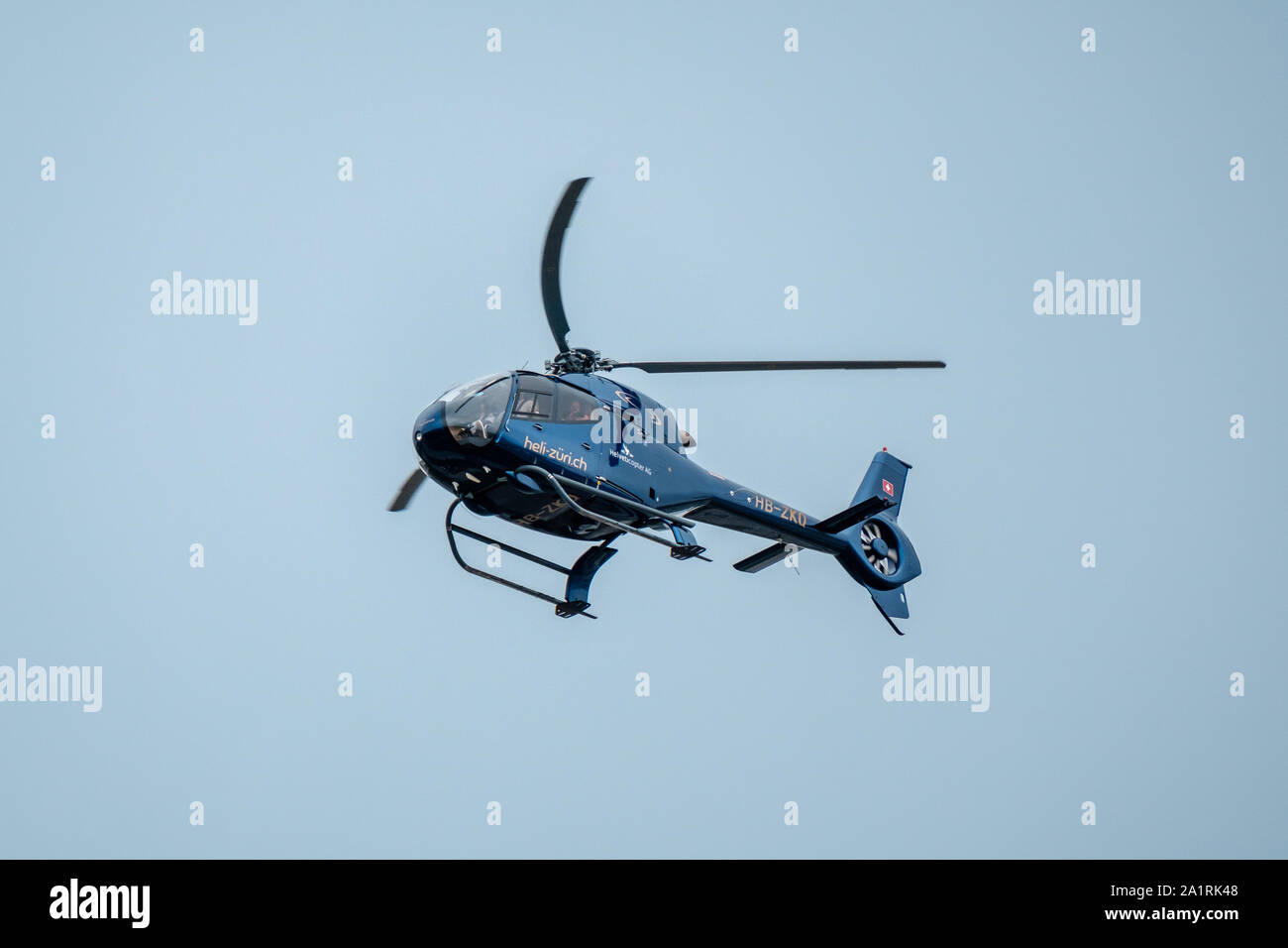 Helicopter lands at international airport Stock Photo - Alamy