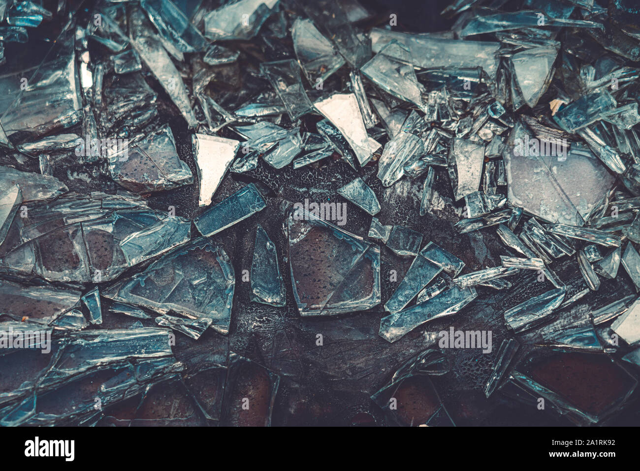 pieces of glass sticking to a scorched surface Stock Photo - Alamy