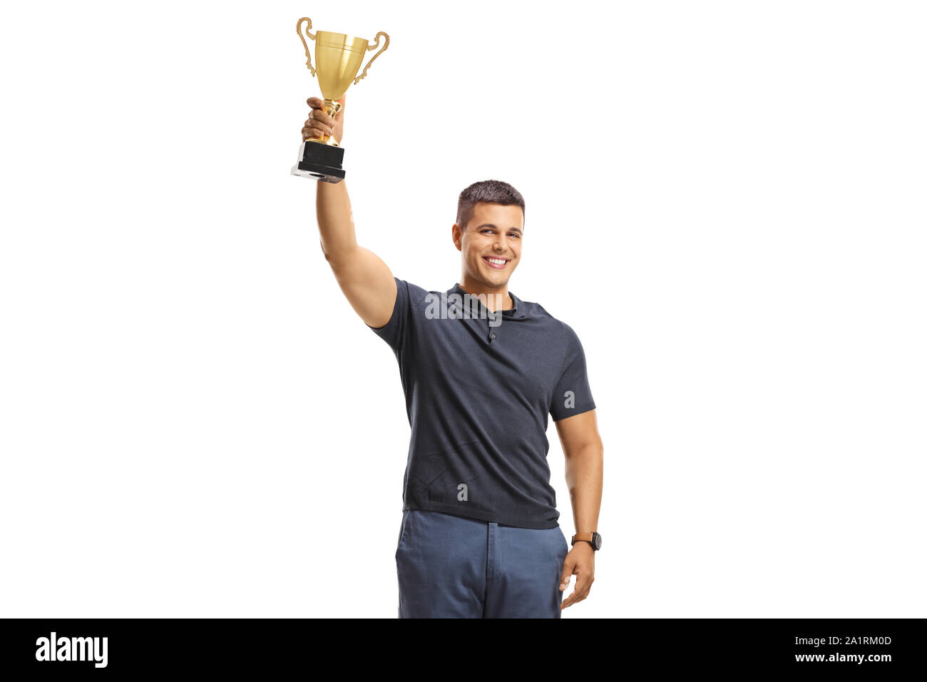 Happy young man with a golden trophy isolated on white background Stock ...