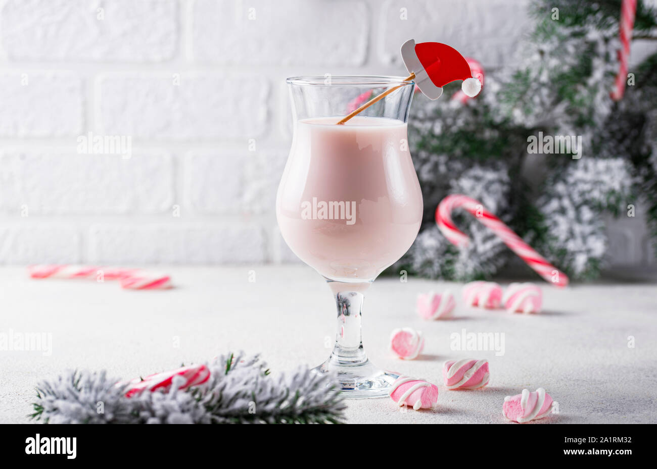 Pink Christmas cocktail with marshmallow Stock Photo - Alamy