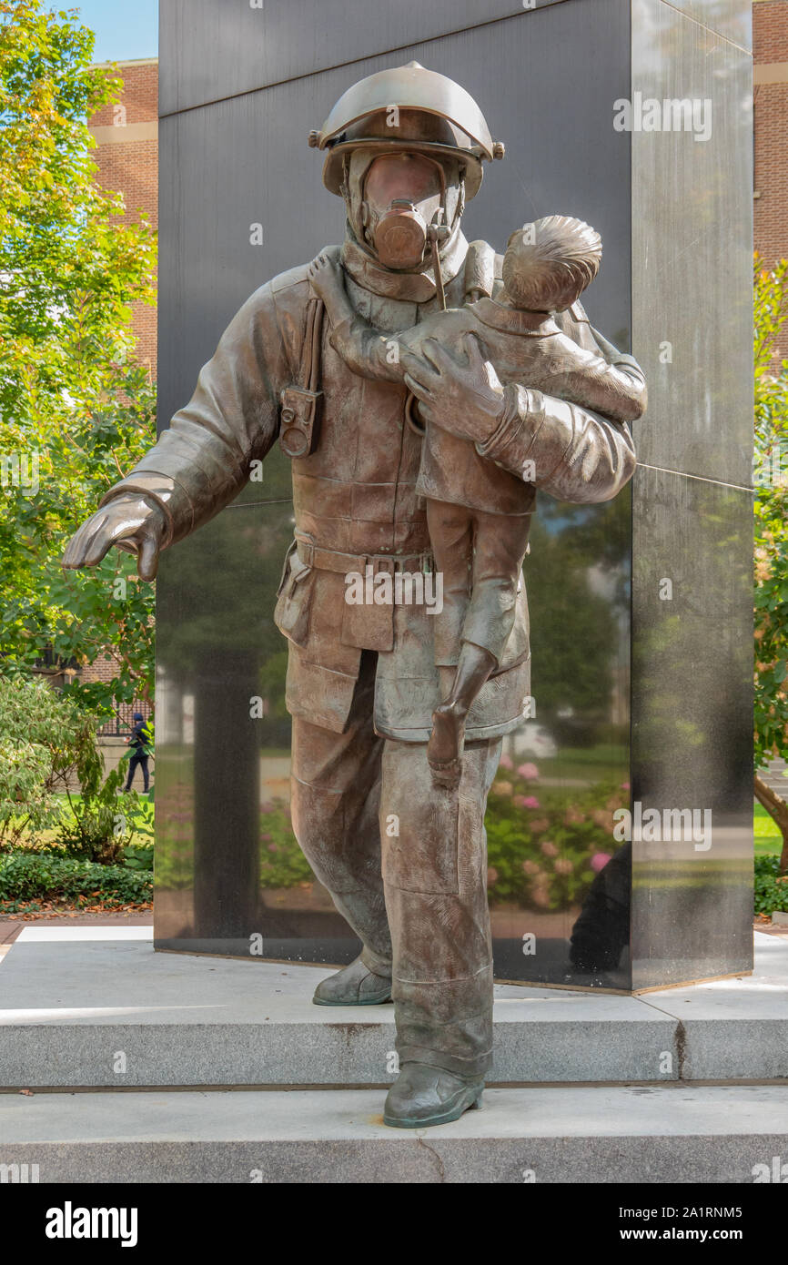 Bronze statue of a firefighter carrying a small child at the Ontario ...
