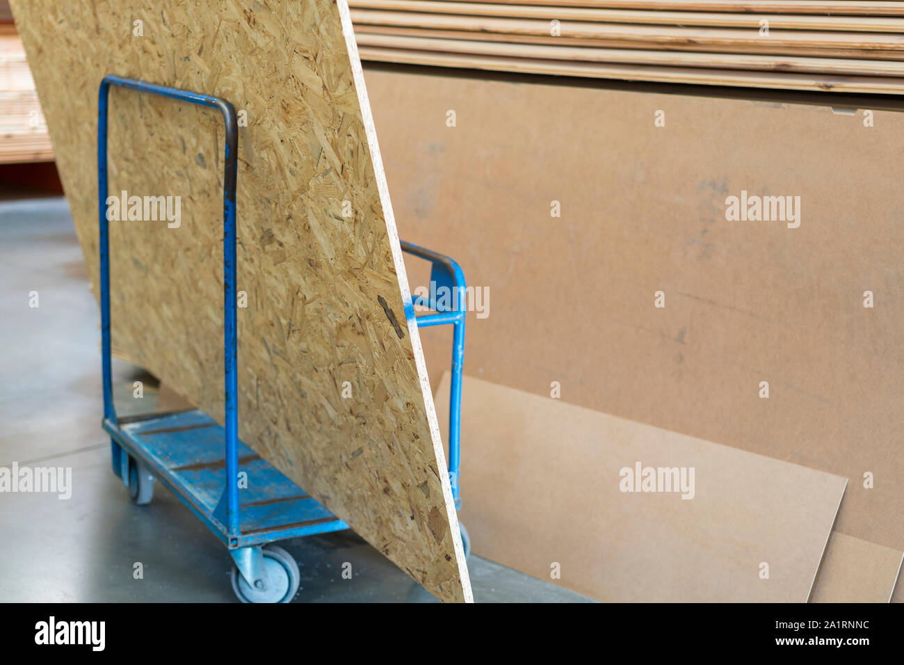 Trolley in a hardware store with building materials. Warehouse large ...