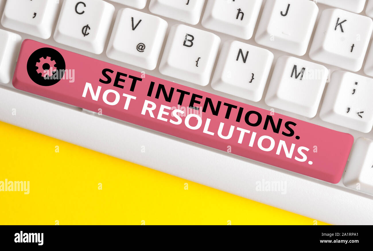 Conceptual hand writing showing Set Intentions Not Resolutions. Concept ...
