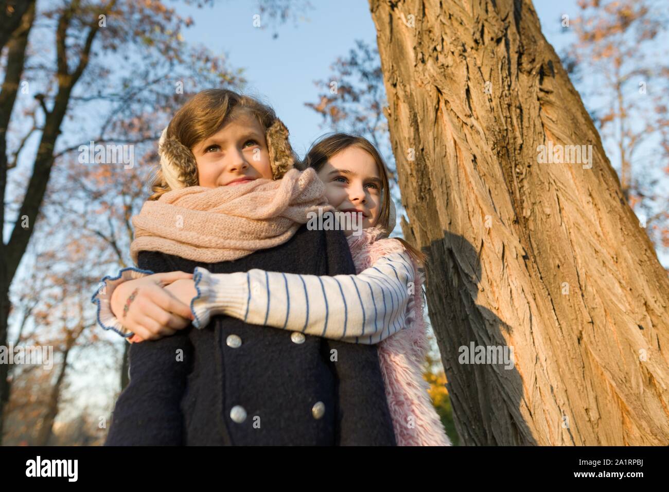Outdoor portrait of two little girls best friends, smiling girls ...