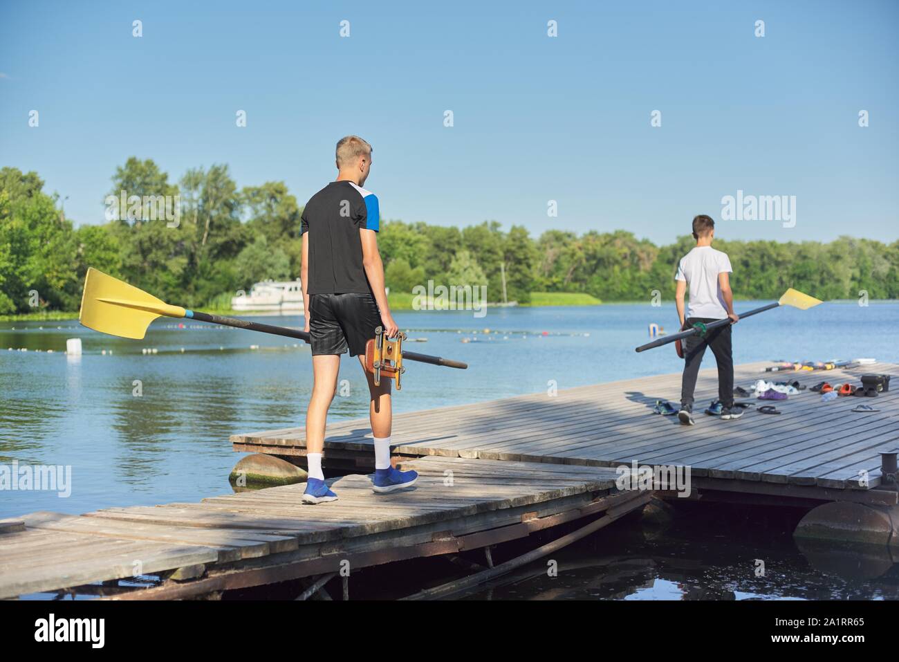Teen rowing boat hi-res stock photography and images - Alamy