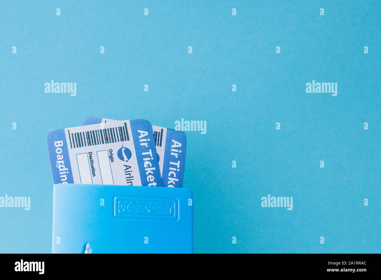 Passport And Air Ticket In Woman Hand On A Blue Background Travel