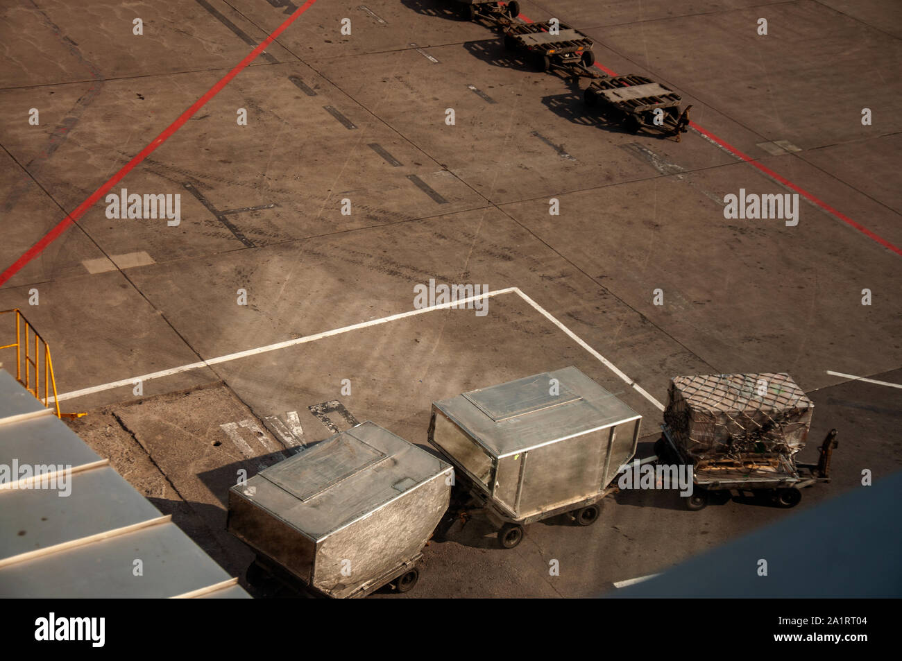 Luggage loading in a passenger plane. Airport baggage service. Airplane ...