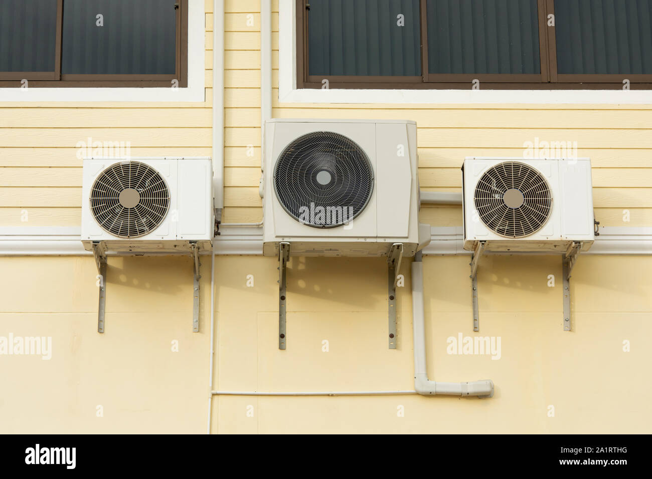 Air conditioning compressor Installed outside the wall of the house ...