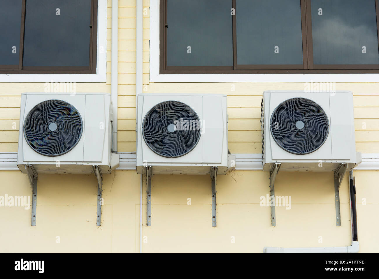 Air conditioning compressor Installed outside the wall of the house ...