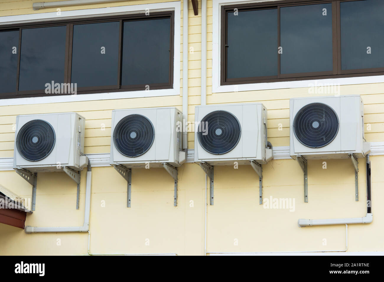 Air conditioning compressor Installed outside the wall of the house ...