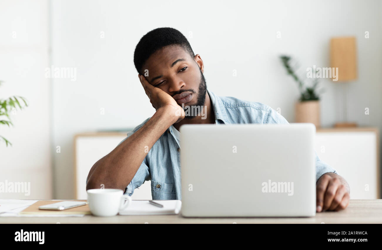 Bored employee sitting in office can not concentrate on work Stock ...