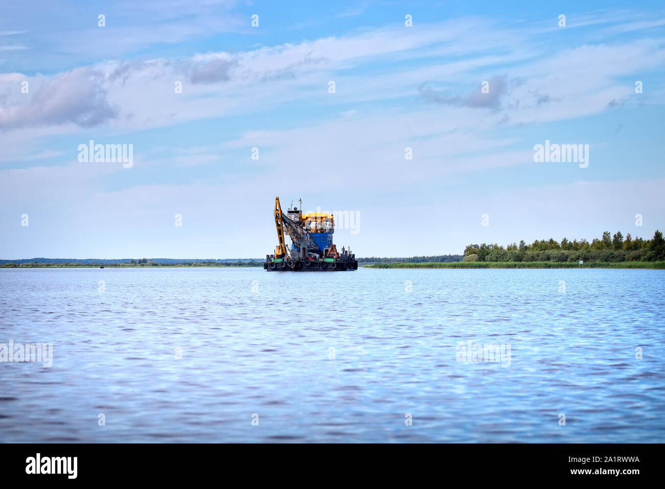 Floating river crane (barge derrick) in the vastness of the river ...