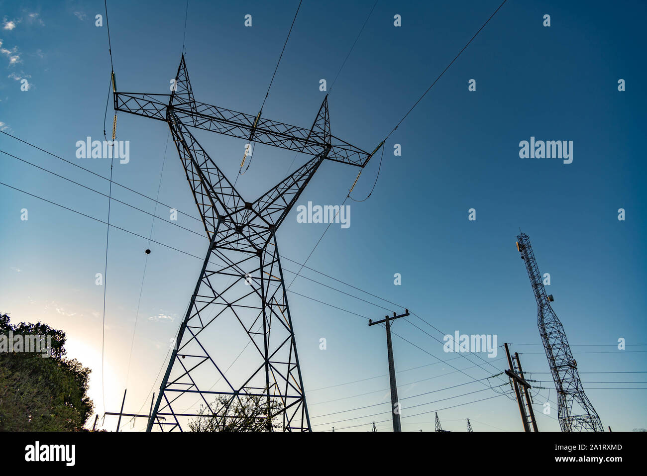 View of an electric power tower in the foreground. Beside, a data ...