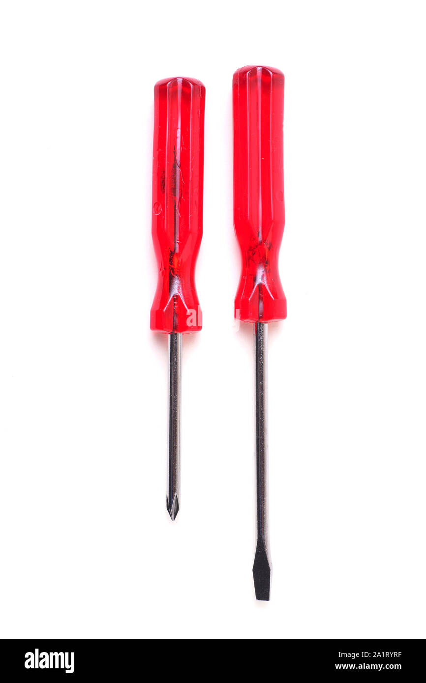 Screw drivers with clear plastic red handles, isolated on white ...