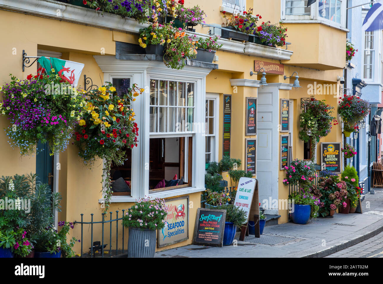 TENBY, WALES, UK - 13th September 2019: Colorful houses along the ...