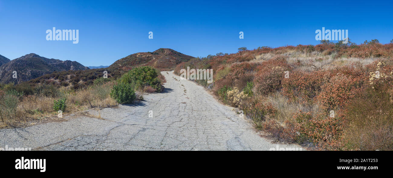 Asphalt access road leads into the mountains of Los Padres National ...