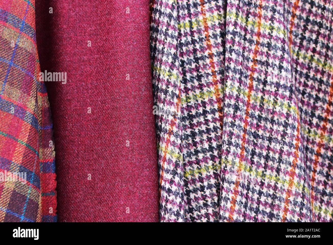 Colorful detailed fabric textures of different cloth types in a close ...