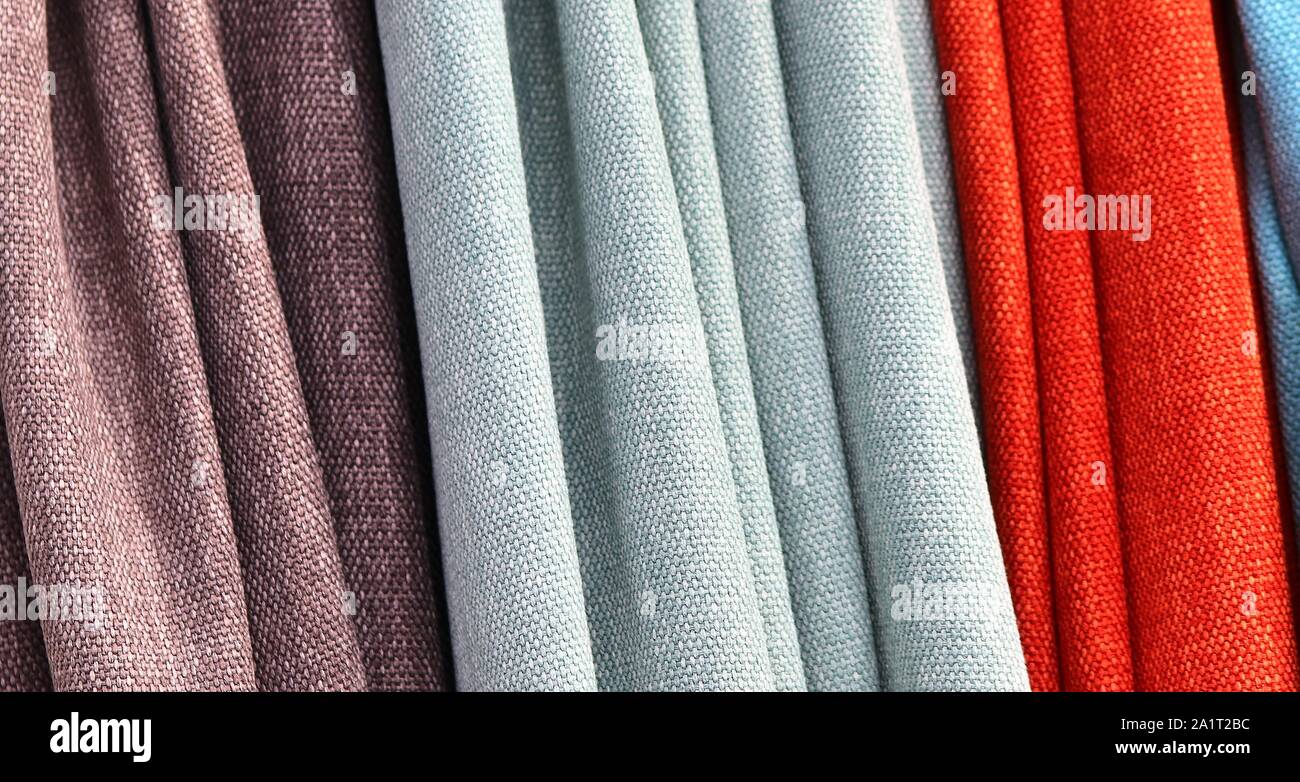 Colorful detailed fabric textures of different cloth types in a close ...