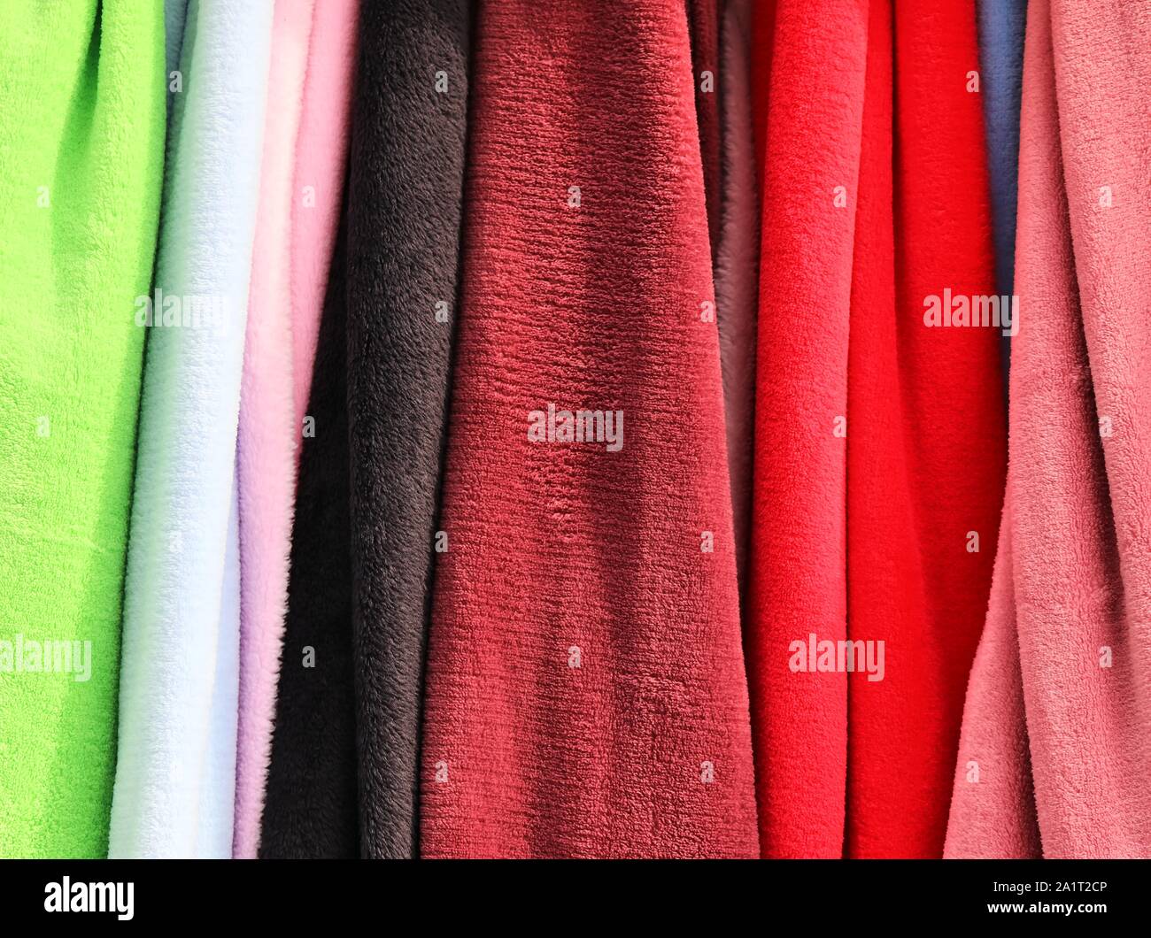 Colorful detailed fabric textures of different cloth types in a close ...