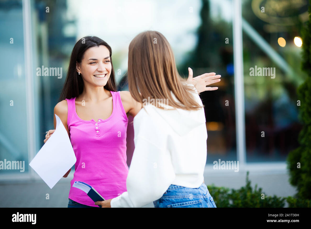 Women business with the poster with welcome message Stock Photo - Alamy