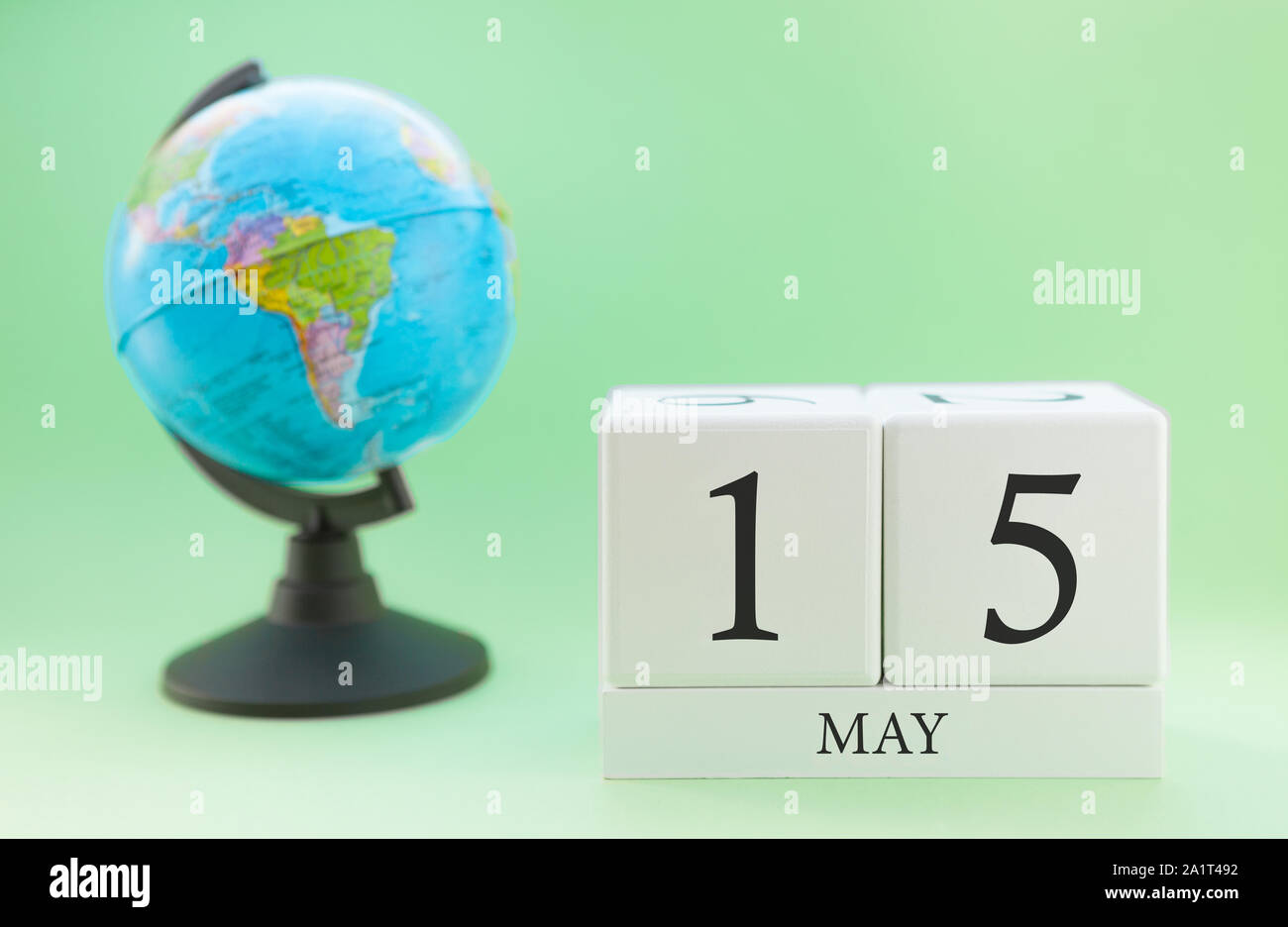 Planner wooden cube with numbers, 15 day of the month of May, spring ...