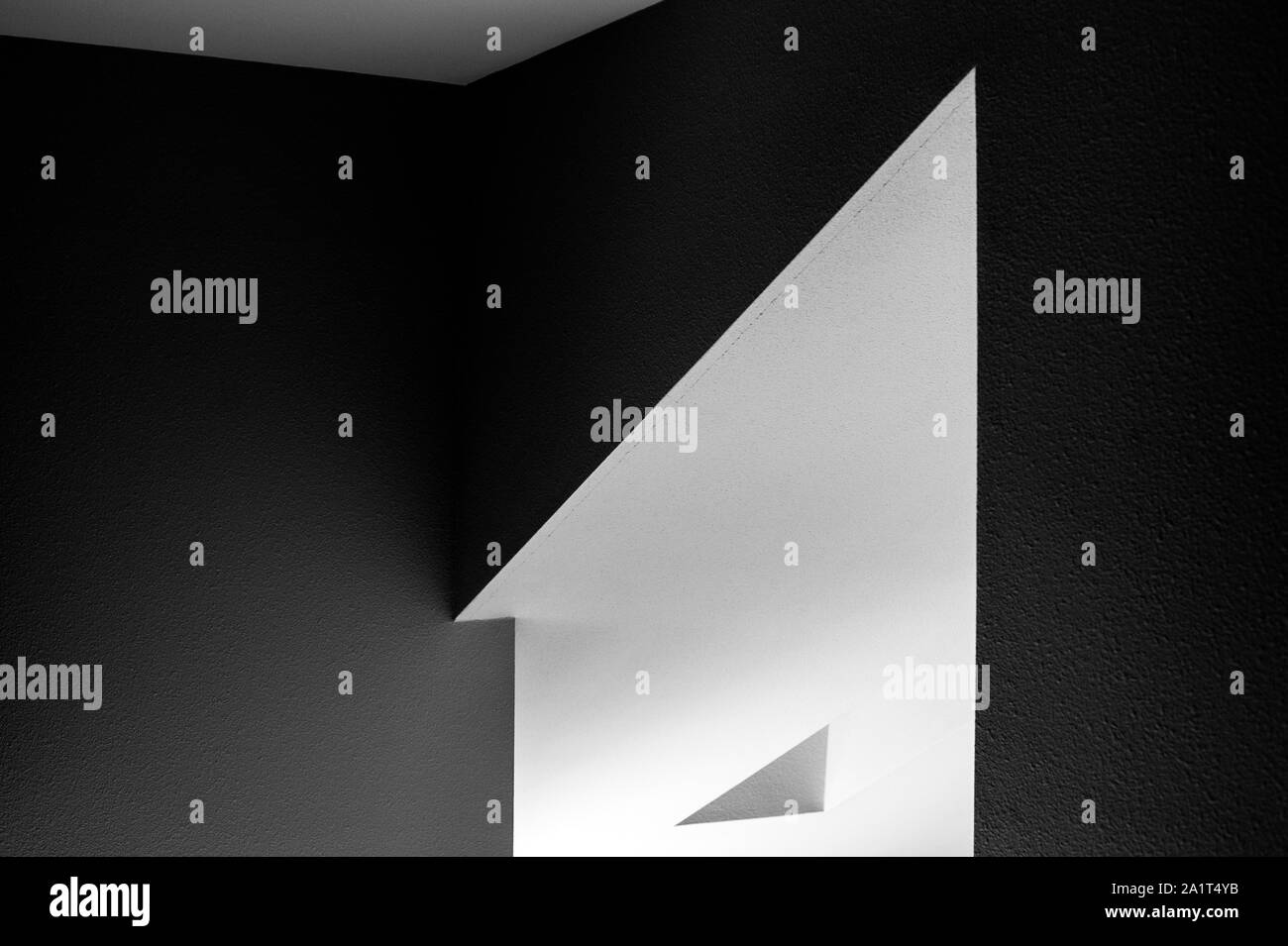 Abstract shapes interior wall with geometric patterns in light and dark ...