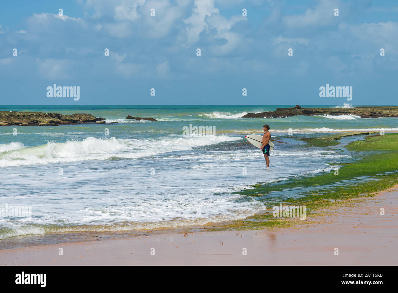Arembepe, Brazil - Circa September 2019: Young black surfer with his ...
