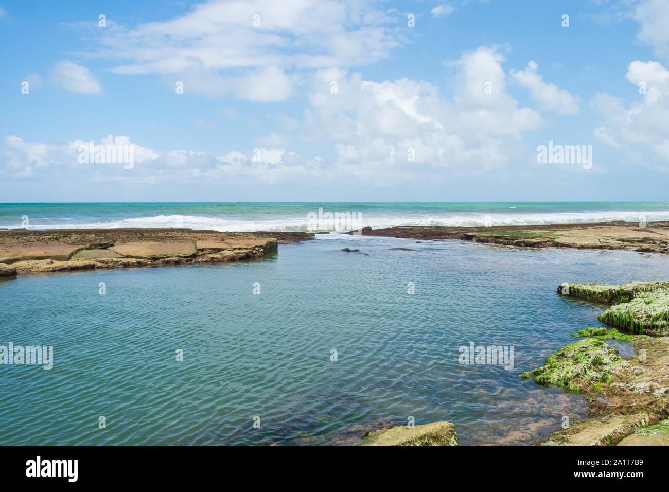 Natural swimming pool at the beach near the Hippie village in Arembepe ...