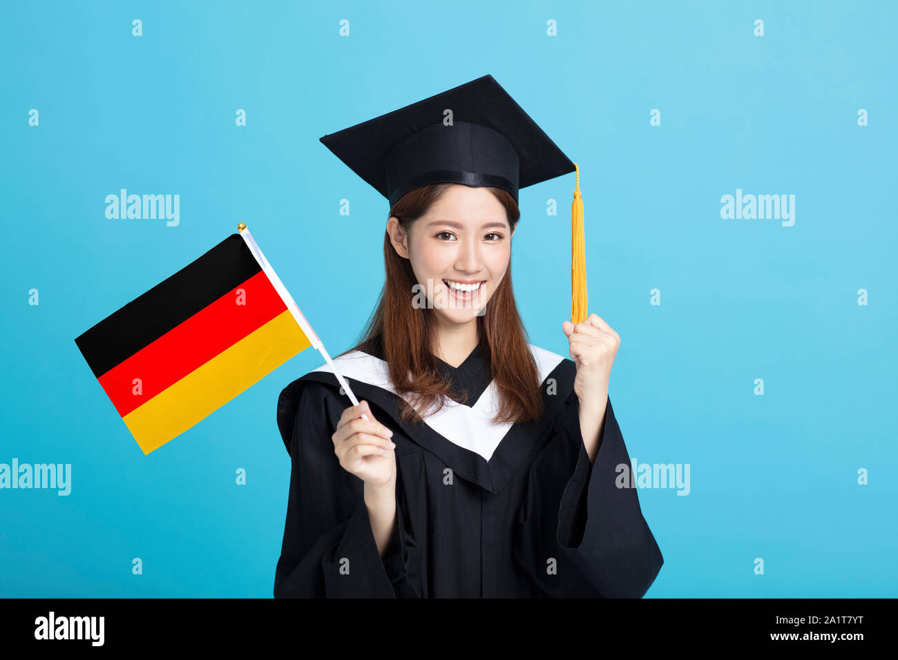 happy Young female graduation student showing the Germany flag Stock ...