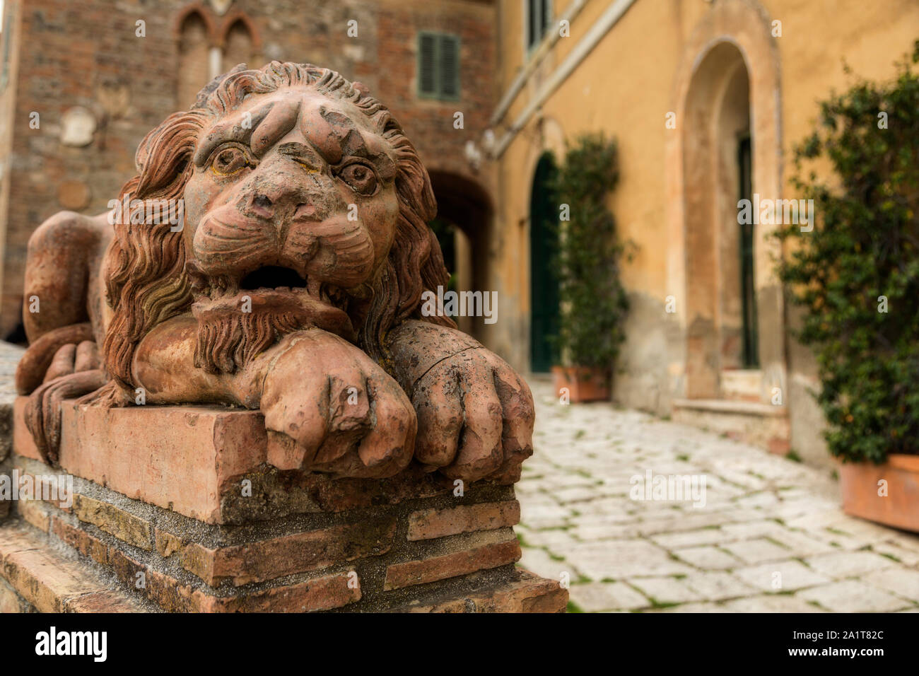 Statue of a lion in a tuscan village in Italy Stock Photo - Alamy