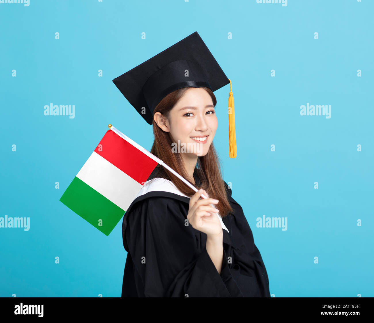 happy Young female graduation student showing the Italy flag Stock ...
