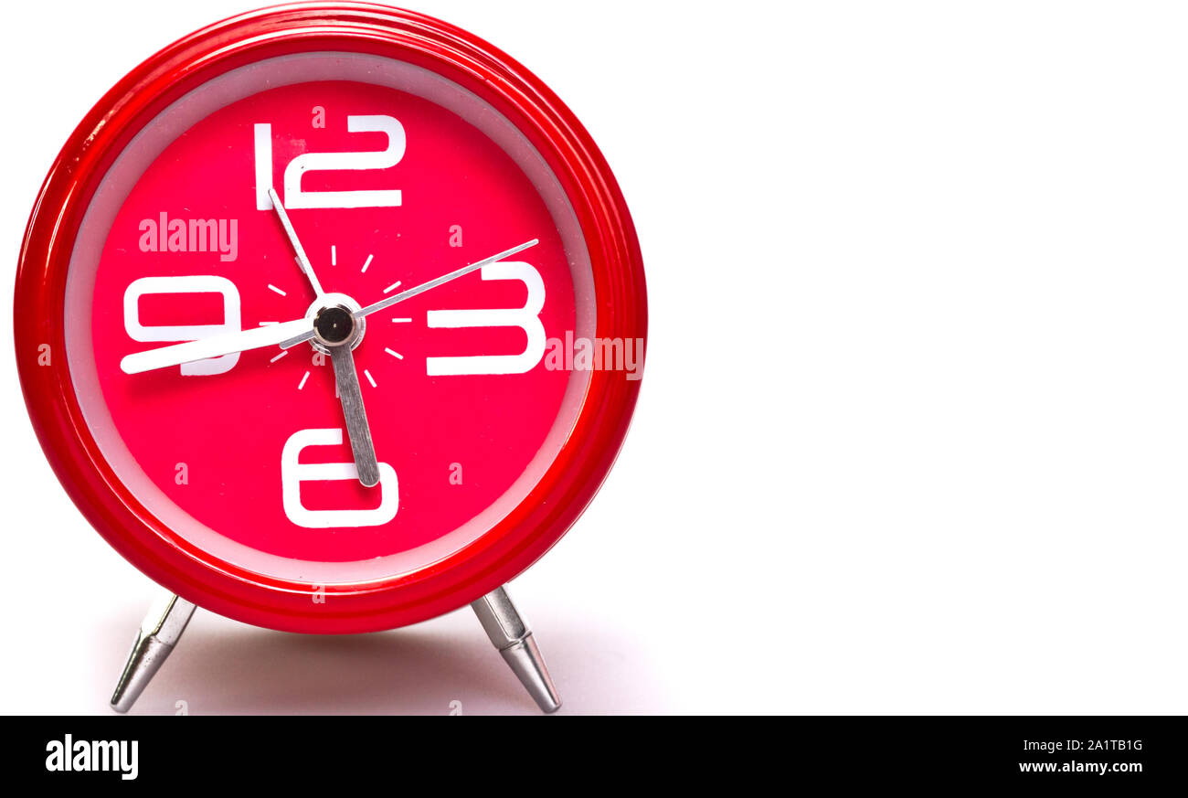 close up of red clock face on white background Stock Photo - Alamy