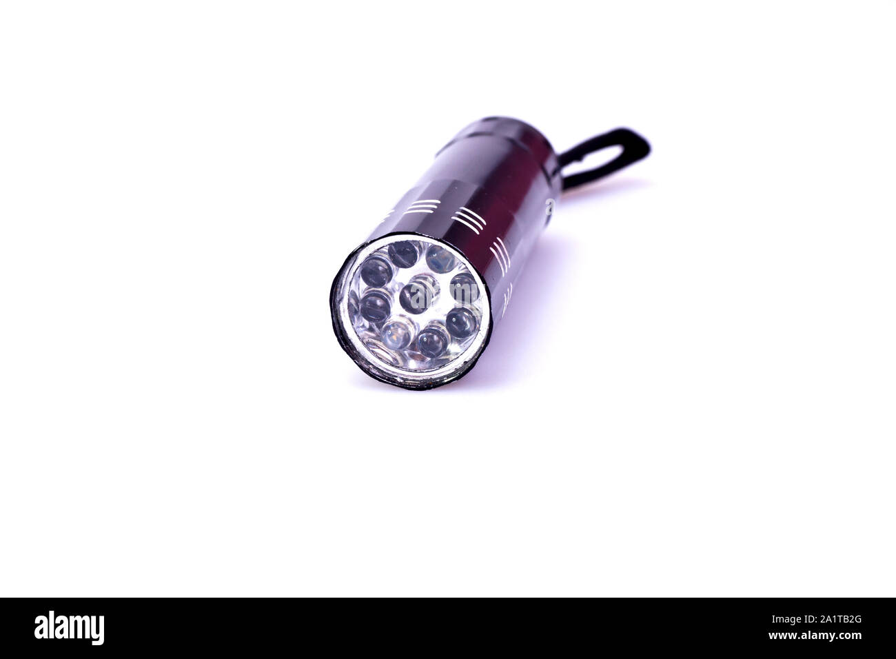 black LED torchlight on white background in close up view Stock Photo ...