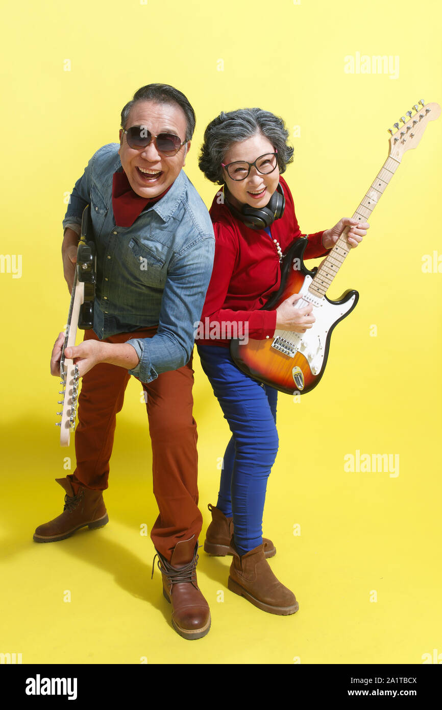 Happy old man playing the guitar Stock Photo - Alamy