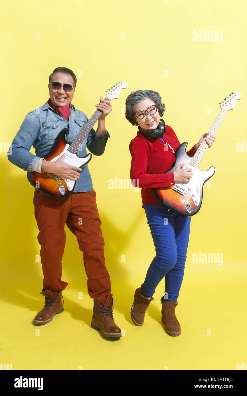 Happy old man playing the guitar Stock Photo - Alamy