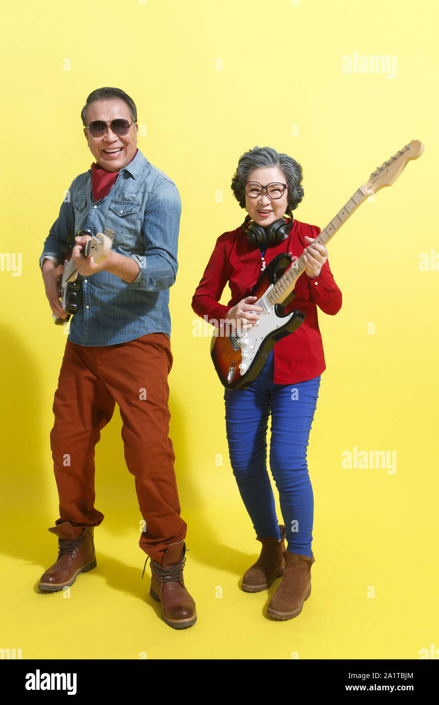 Happy old man playing the guitar Stock Photo - Alamy