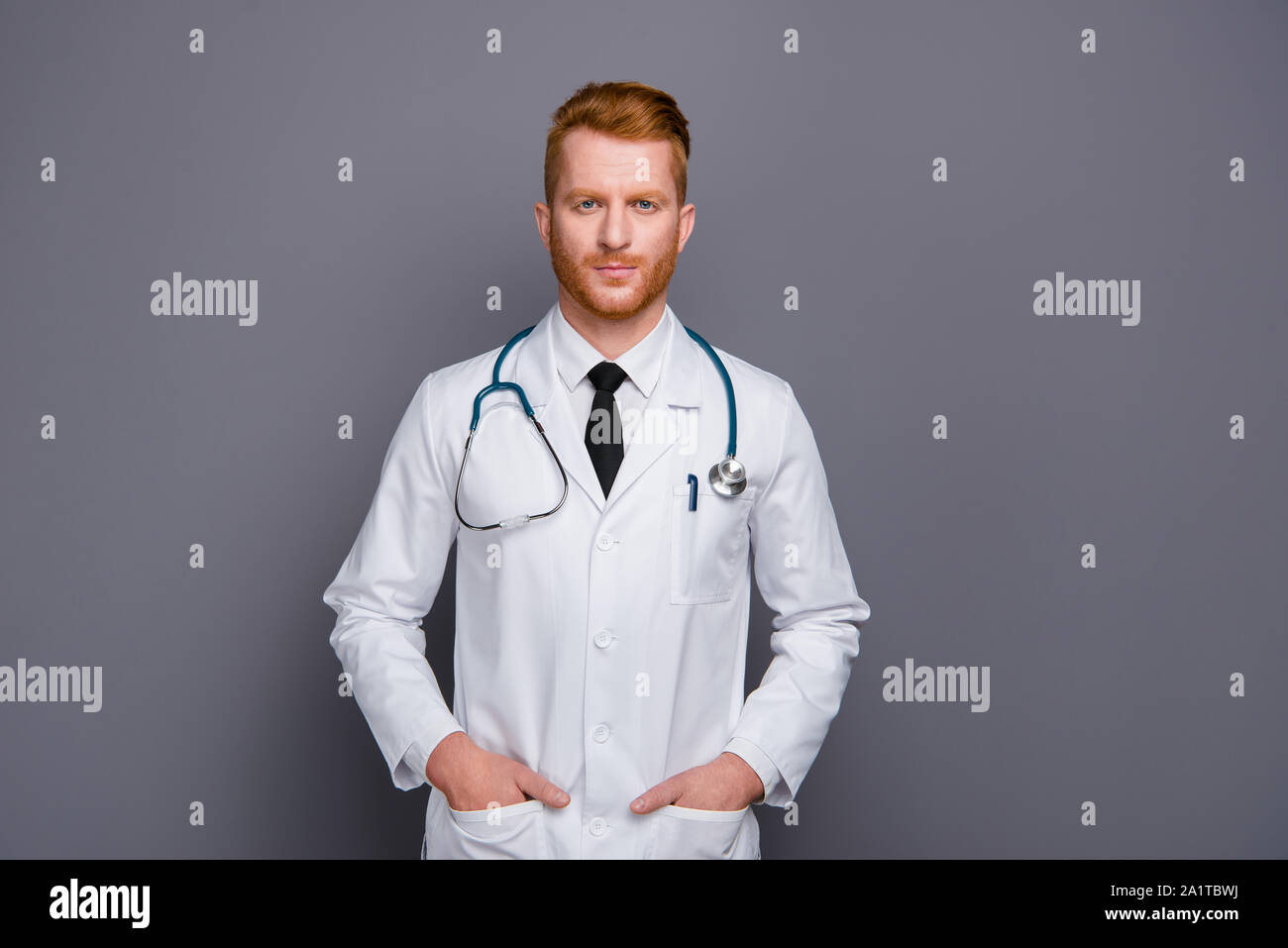 Photo of good-looking doc man look at camera with calm face hold Stock ...