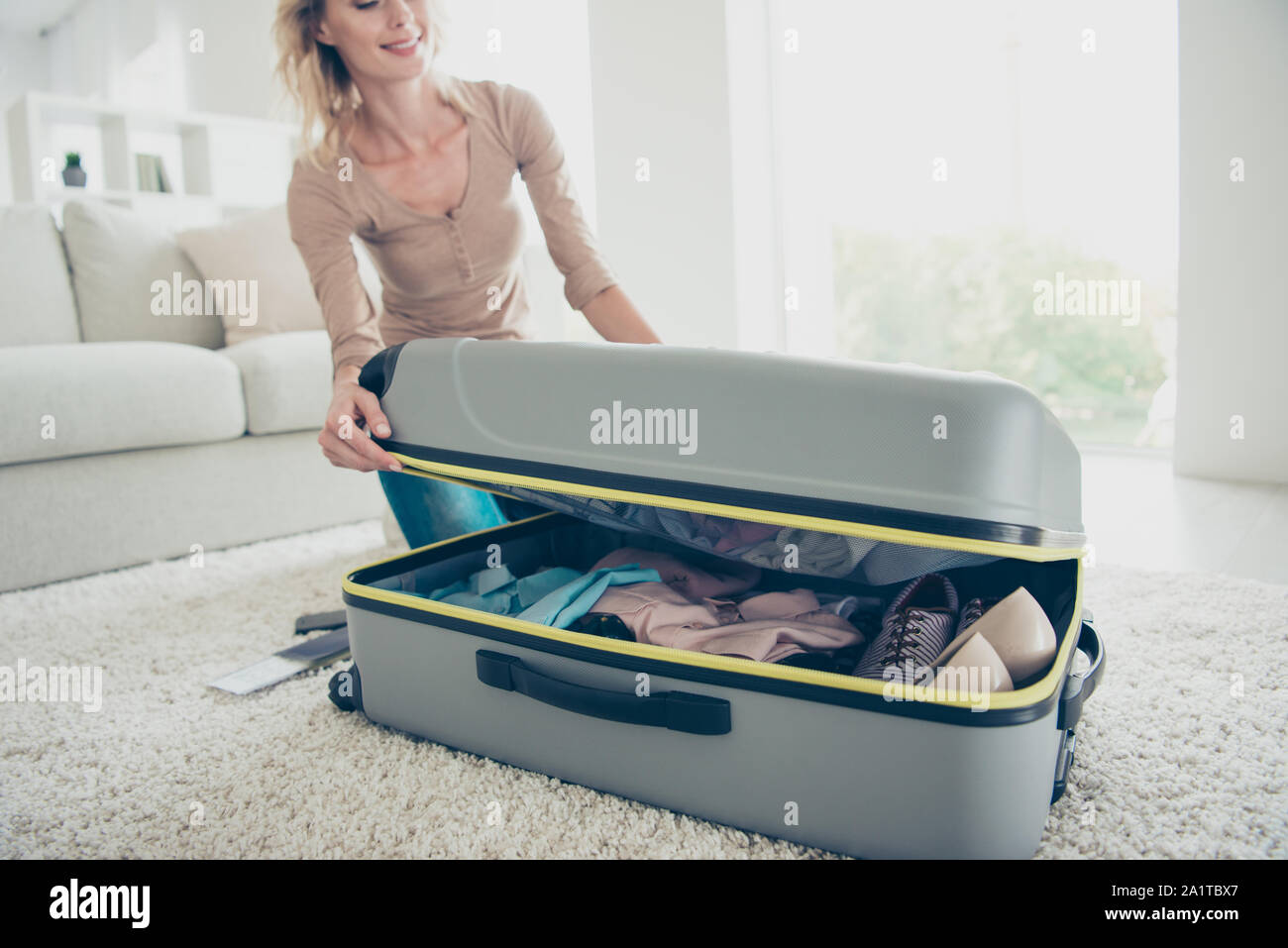 Cropped photo oh lady hands her closed gray big bag she ready go Stock ...