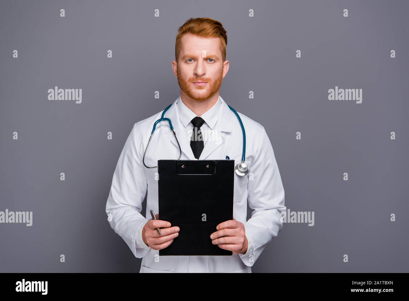 Photo of good-looking handsome doctor isolated on dark gray back Stock ...