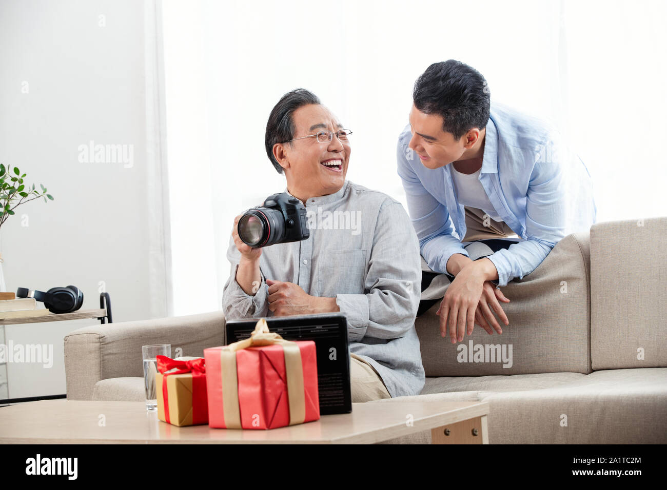 Happy father and son to see the camera Stock Photo - Alamy