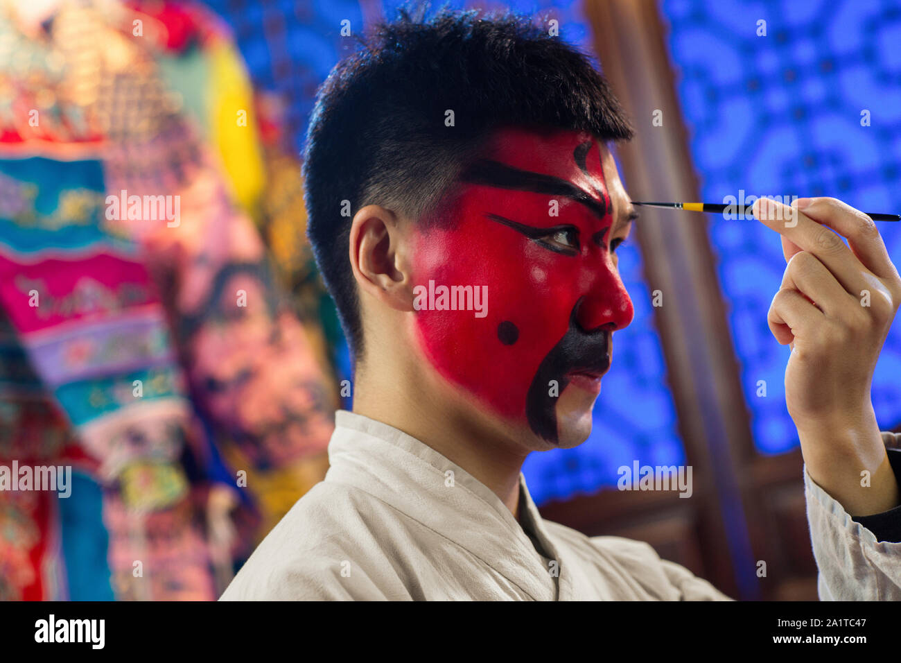 Male Peking Opera actor backstage makeup Stock Photo - Alamy