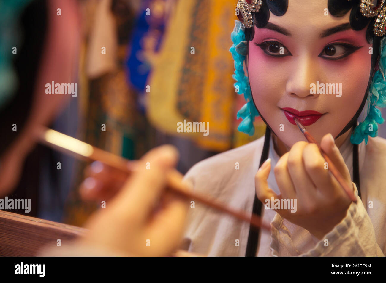 Female Peking Opera actor backstage makeup Stock Photo - Alamy