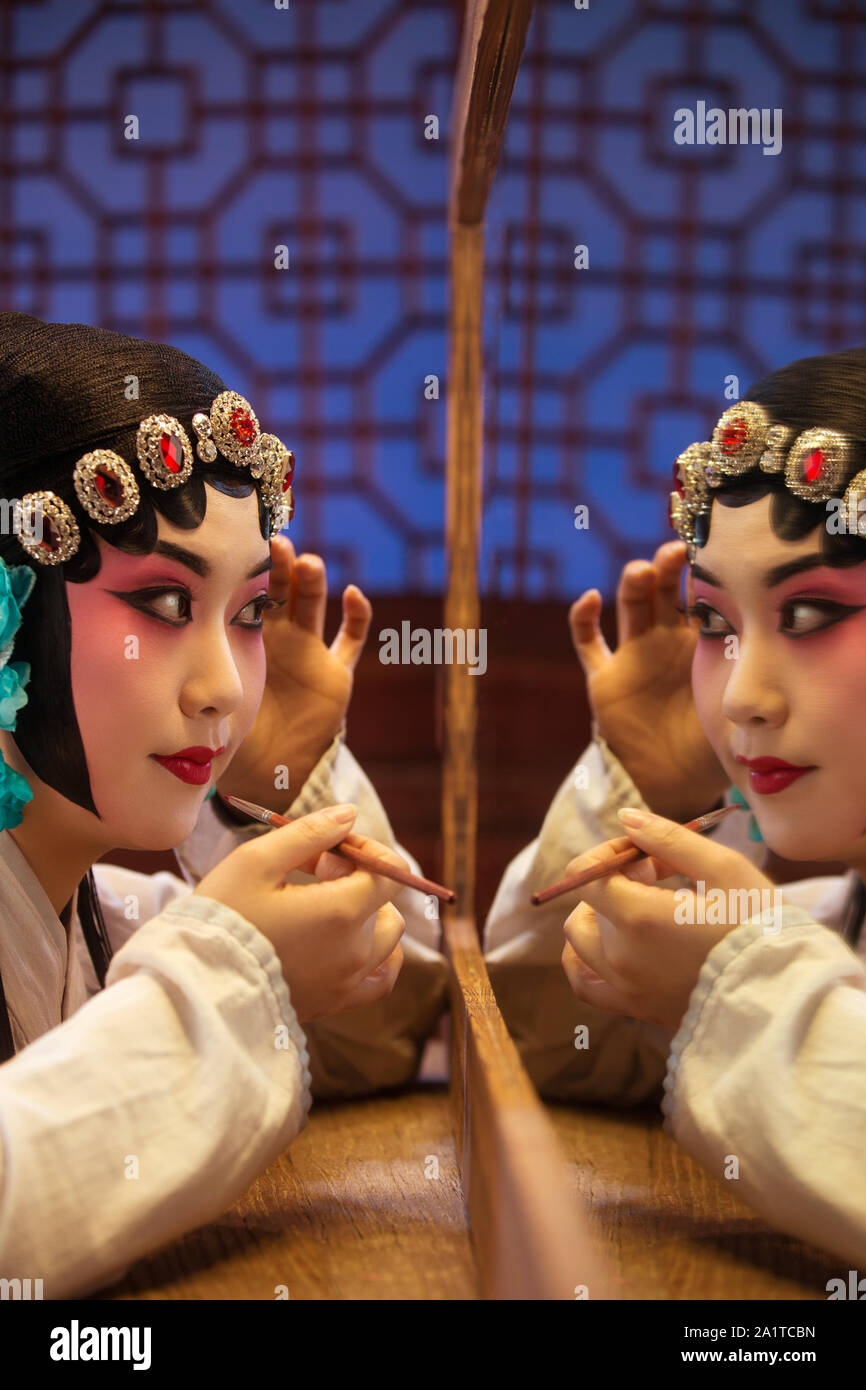 Female Peking Opera actor backstage makeup Stock Photo - Alamy