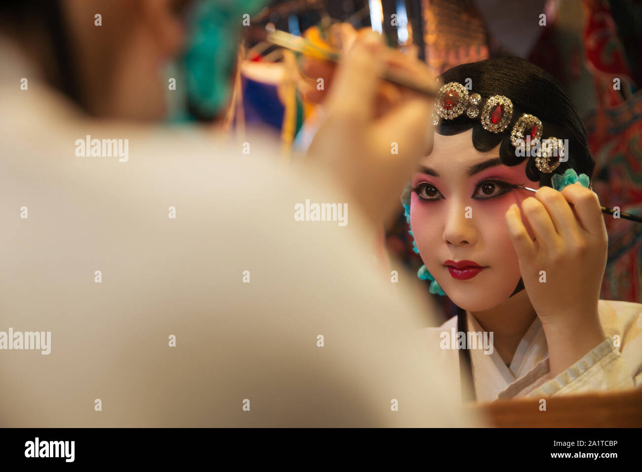 Female Peking Opera actor backstage makeup Stock Photo - Alamy