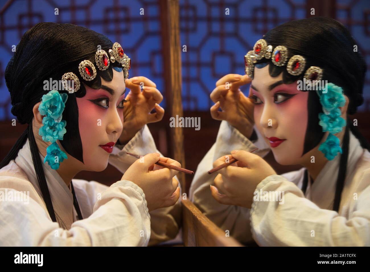 Female Peking Opera actor backstage makeup Stock Photo - Alamy